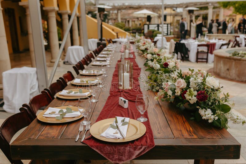 Long Table Set for Dinner at Outdoor Party Setting with Red Table ...