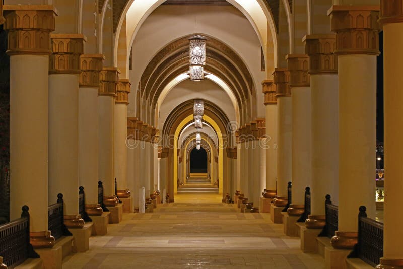 Long Passageway Lined with Pillars and Lit from the Top at Night Stock ...
