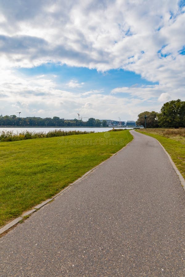 Long Path Next To Big Lake with Beauty Cloudy Sky Stock Image - Image ...