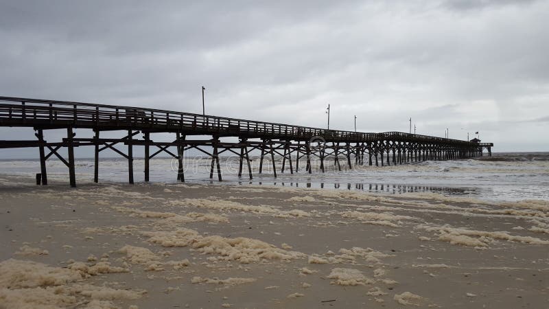 Long pier at the beach stock photo. Image of rusted, bolt - 62593680
