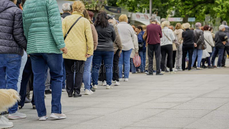 Long Queue of People in Street, Back View Stock Photo - Image of ...