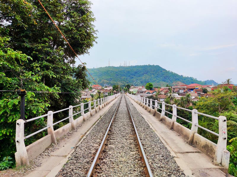 Long Railway Bridge with Mountain Views and White Sky. Landscape Mode ...