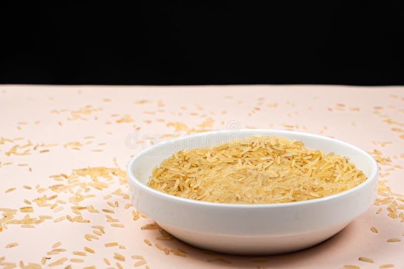 Long Raw Dry Grain Parboiled Basmati Rice in the Plate Stock Image ...