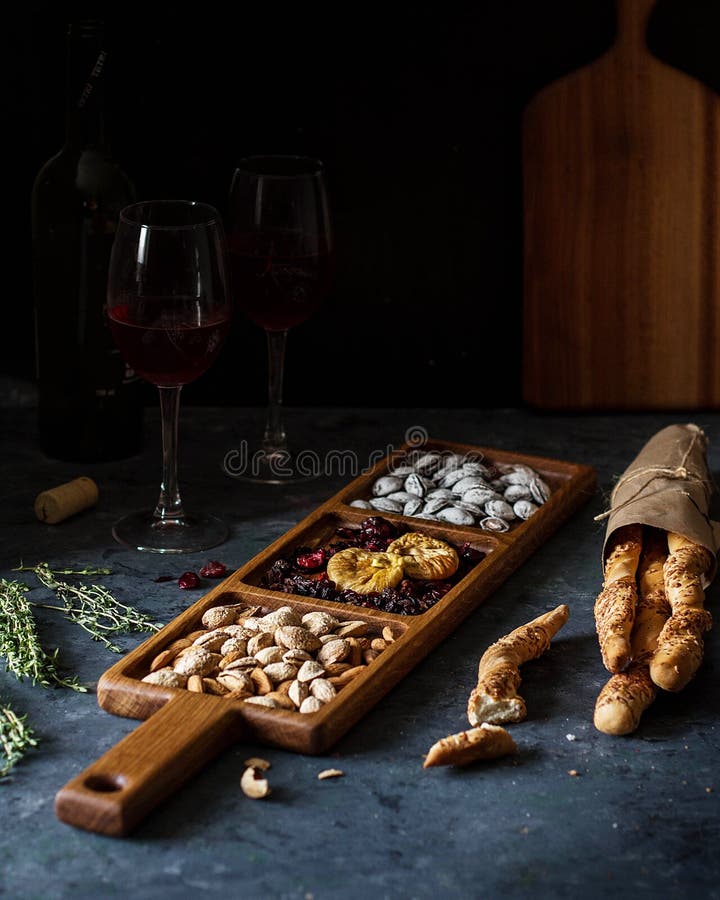 A Long Rectangular Wooden Mini-bar for Snacks on a Table with Wine ...