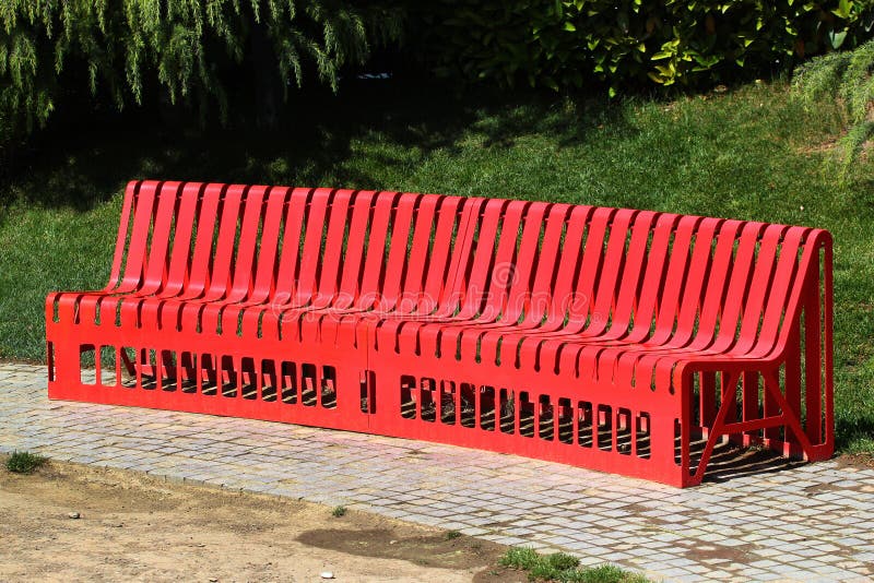 Long Red Metal Bench in a Public Park Stock Image - Image of garden ...