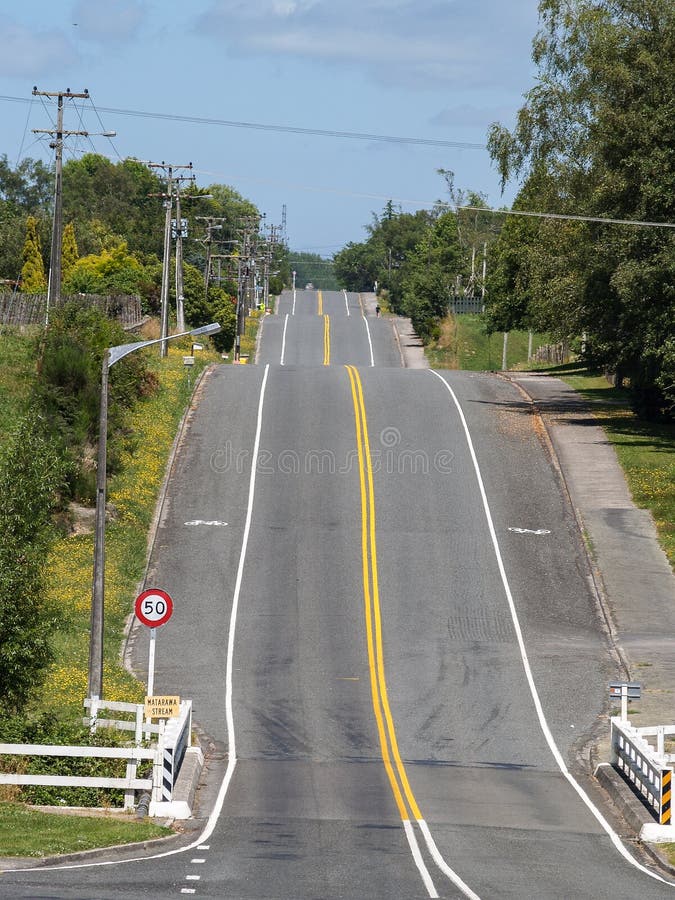 Long Road Ahead Undulating with Double Yellow Lines Stock Image - Image ...