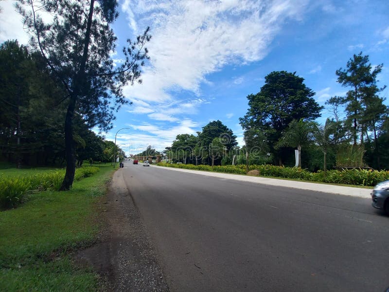 Long road alone afternoon stock photo. Image of street - 265899326