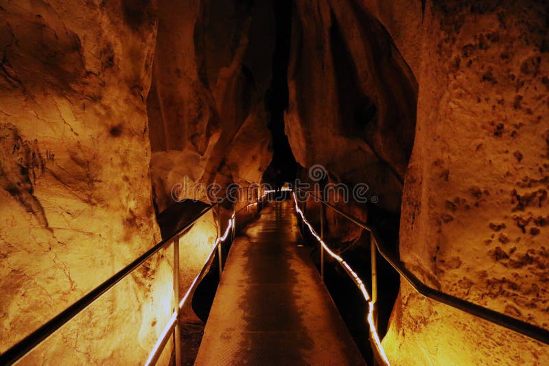 Long Road in a cave stock photo. Image of dark, caveroad - 135568952