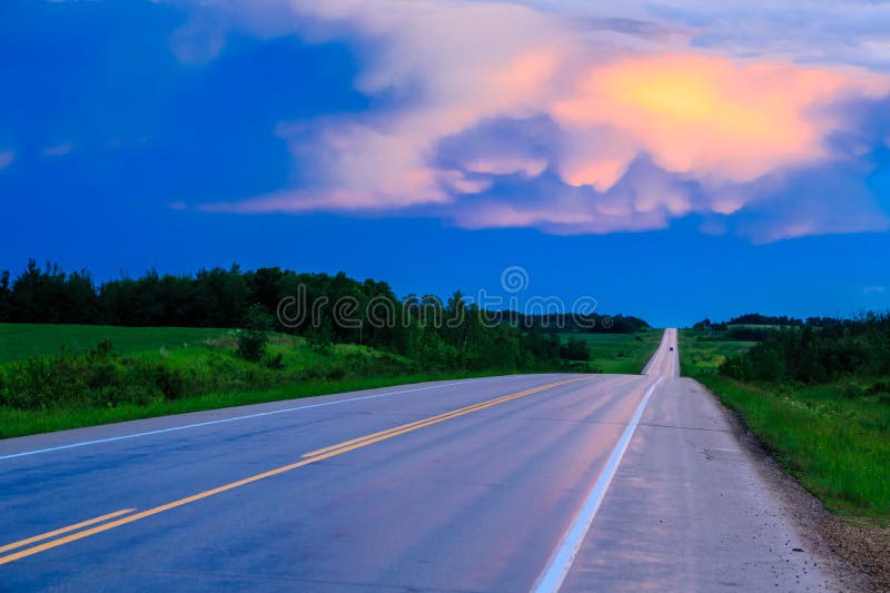 A Long Road with a Few Trees in the Background Stock Image - Image of ...