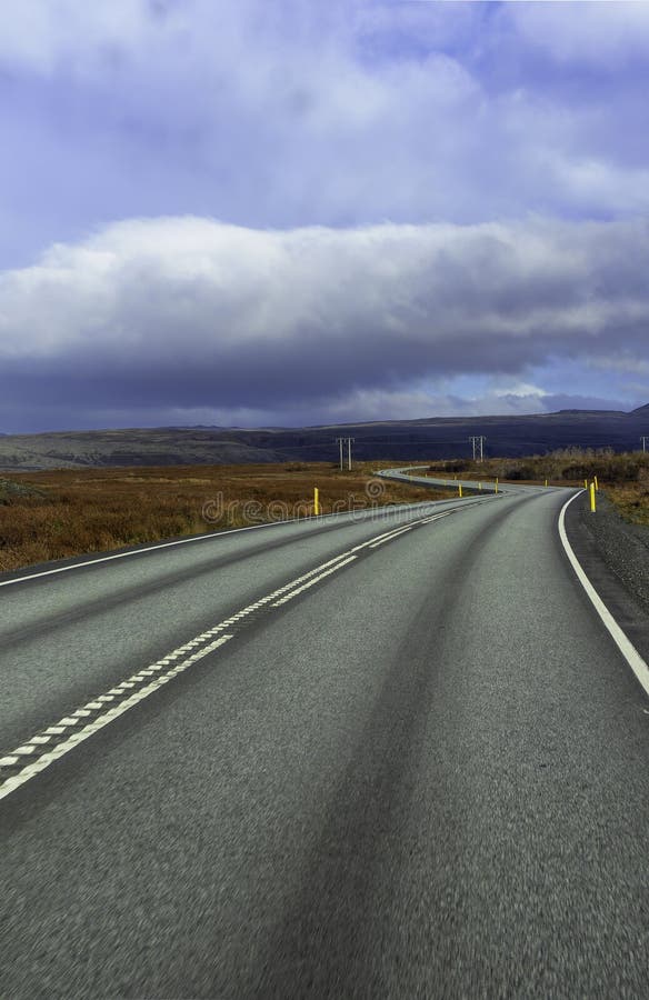 A Long Road with a Few Yellow Posts Stock Photo - Image of mountains ...