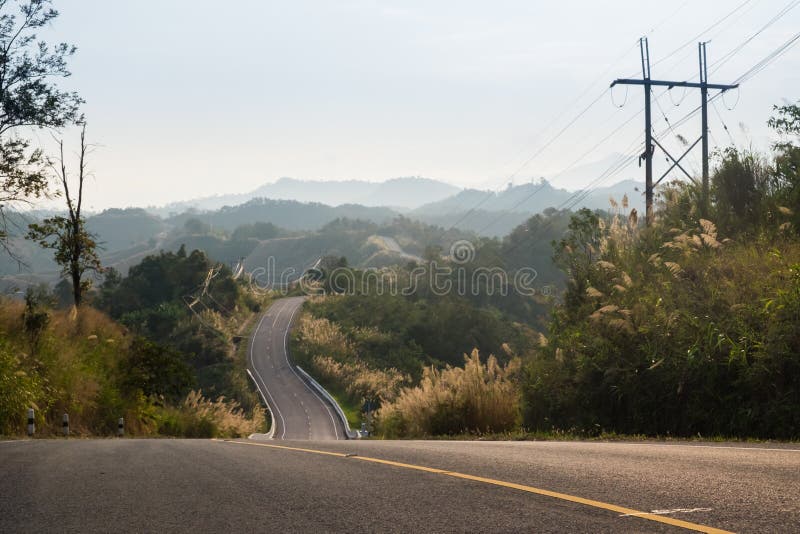 Long road into mountain stock photo. Image of highway - 66812026