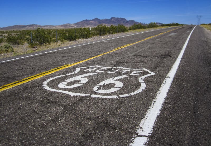 Long Road with a Route 66 Sign Painted on it Stock Image - Image of ...