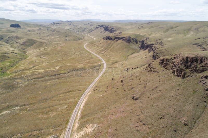 A Long Road Winds through a Desert Landscape Stock Photo - Image of ...