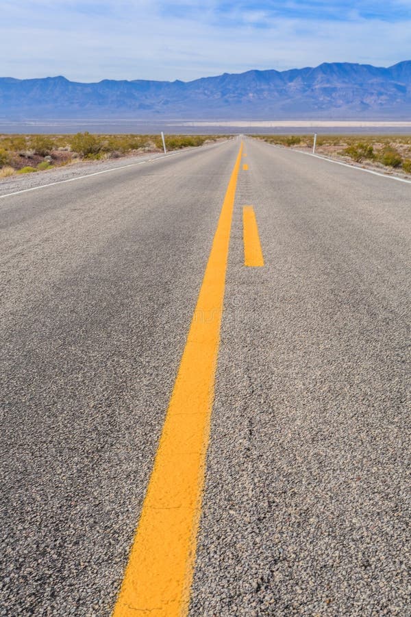 A Long Road with a Yellow Line Down the Middle Stock Photo - Image of ...