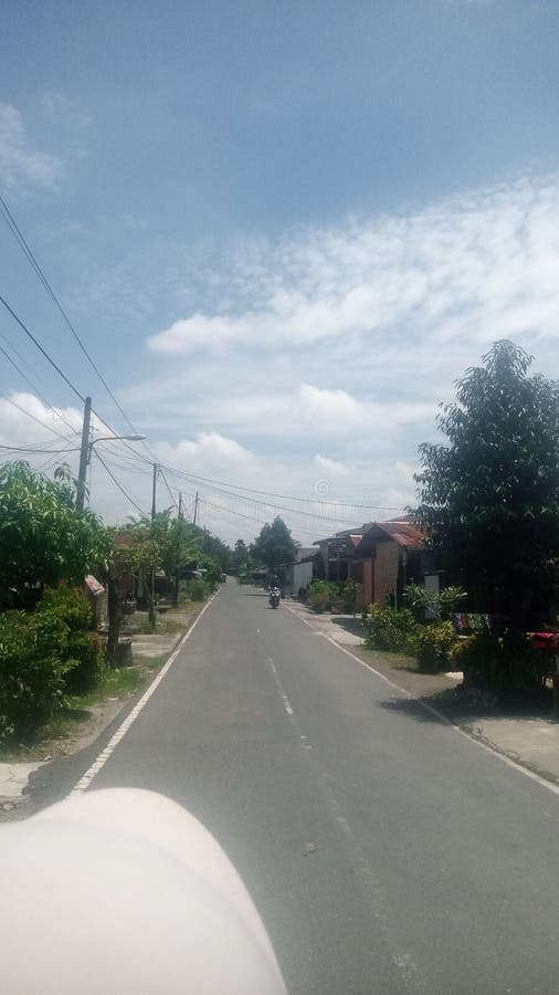 A long roadway stock image. Image of town, property - 264268425