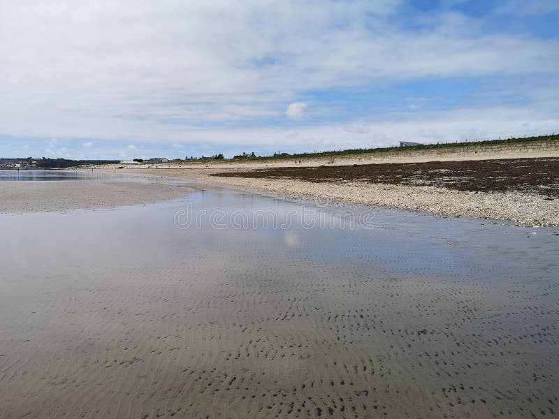 Long Rock beach reflection stock photo. Image of beach - 224707554