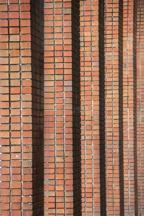 Long Row of Bricks Outside of a Building Stock Photo - Image of roof ...
