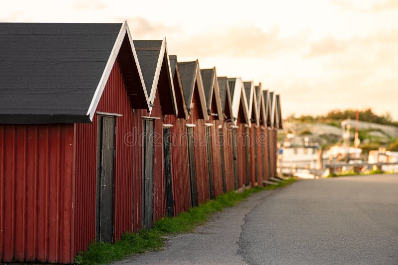 Long Row of Red Boat Houses.. Stock Photo - Image of season, blue ...