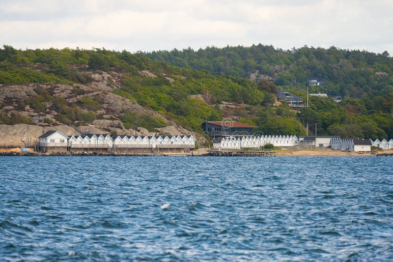 Long Row of Small Beach Houses by a Beach.. Stock Photo - Image of ...