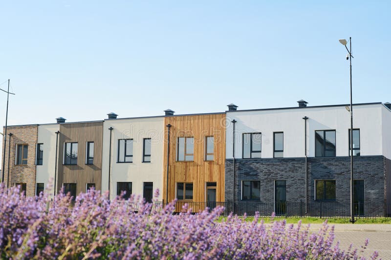 Long Row of Small Houses of Neutral Colors with Rectangular Windows ...