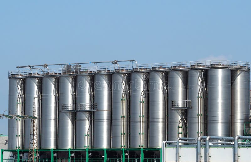 Long Row of Stainless Storage Silos for Liquids and Differents Types of ...
