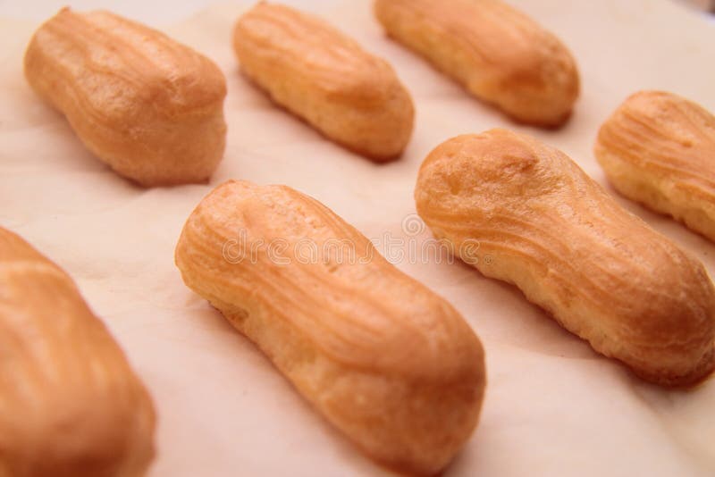 Long Rows Eclair Shells. Eclairs Candy Paper. the Process of Making ...