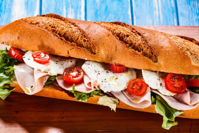 Long Sandwich with Ham, Cheese, Tomatoes, Red Onion and Lettuce. Stock ...