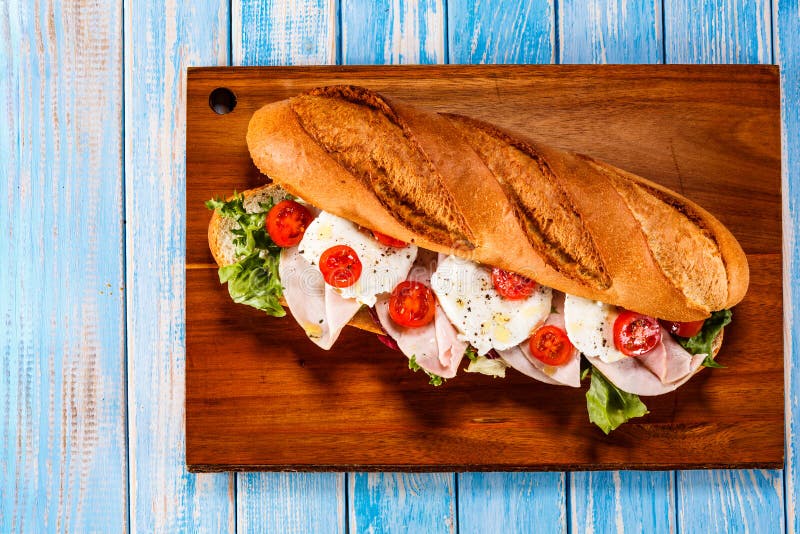 Long Sandwich with Ham, Cheese, Tomatoes, Red Onion and Lettuce. Stock ...