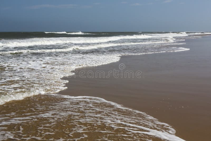 A Long Sea Wave on a Sandy Ocean Beach Stock Photo - Image of blue ...