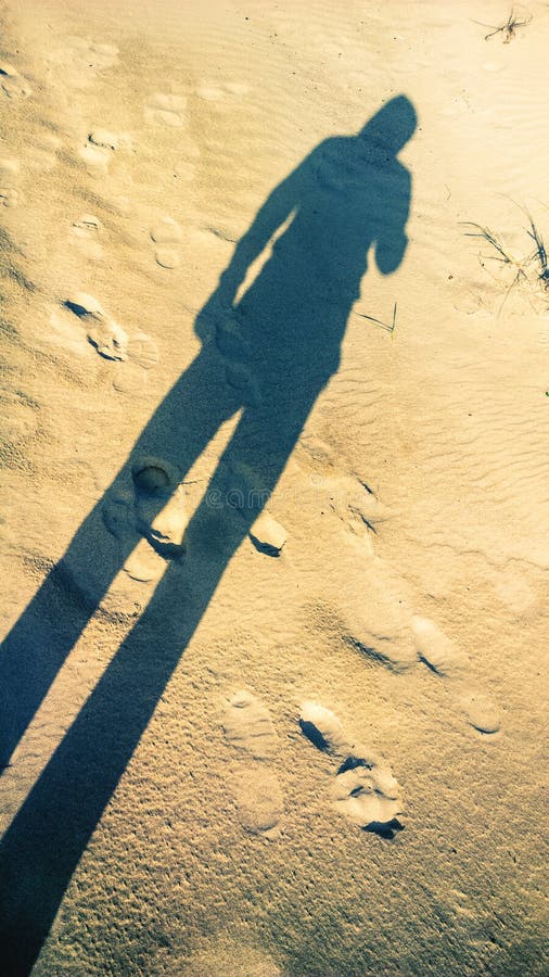 Long shadow stock image. Image of pants, foot, prints - 119229245