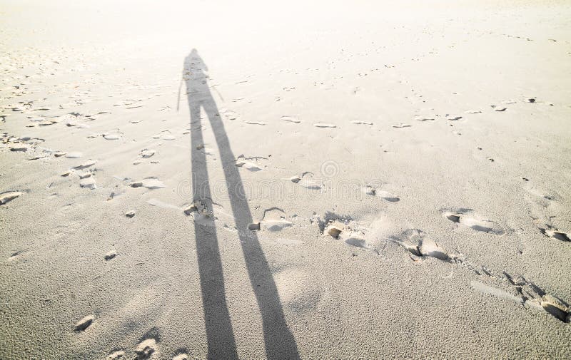 Long Shadow of Man Standing on the Sandy Beach Stock Photo - Image of ...
