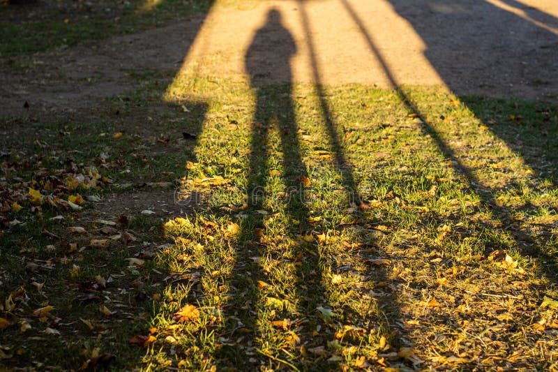 The Long Shadow of a Person Standing in the Late Afternoon Sunshine ...