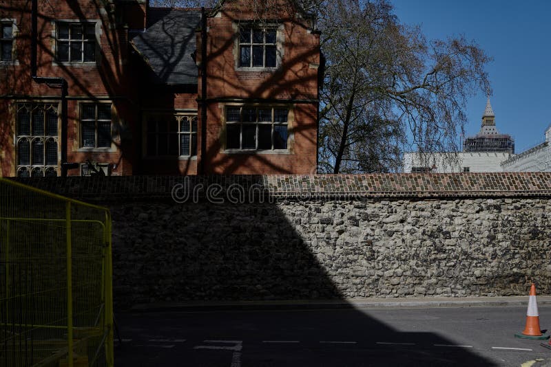 Long Shadow and Sunshine Over Old Grey Brick Wall and Old Red Brick ...