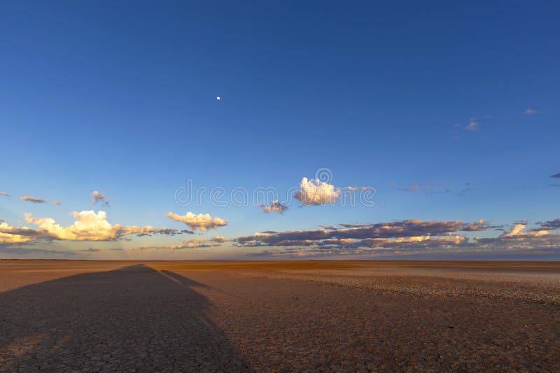 Long Shadows on Verneukpan and Clouds on the Horizon Stock Photo ...