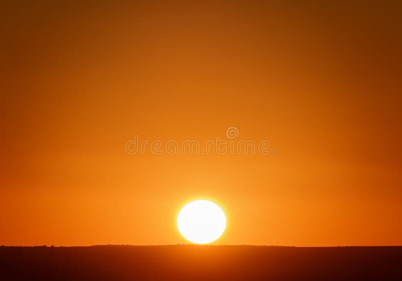 Beautiful Sunset with Orange Sky and Complete Sun Stock Photo - Image ...