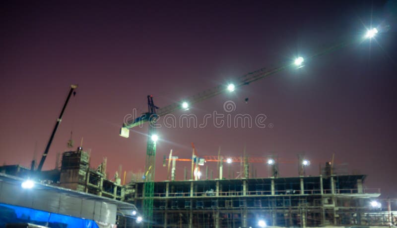 Long Shot. Building and Tower Crane with Illumination (bokeh) Stock ...