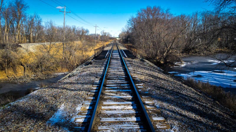 Long Shot of Railroad Tracks Over Frozen River Stock Photo - Image of ...