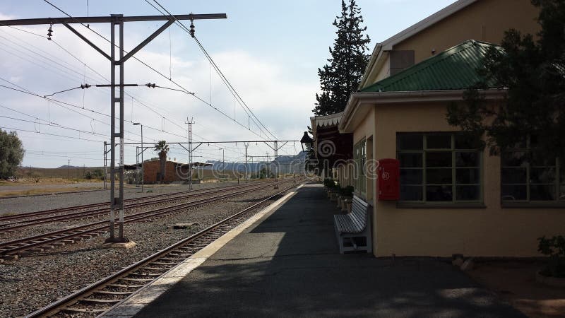 Long Shot of Train Tracks beside a Shop on a Sunny Day Stock Image ...