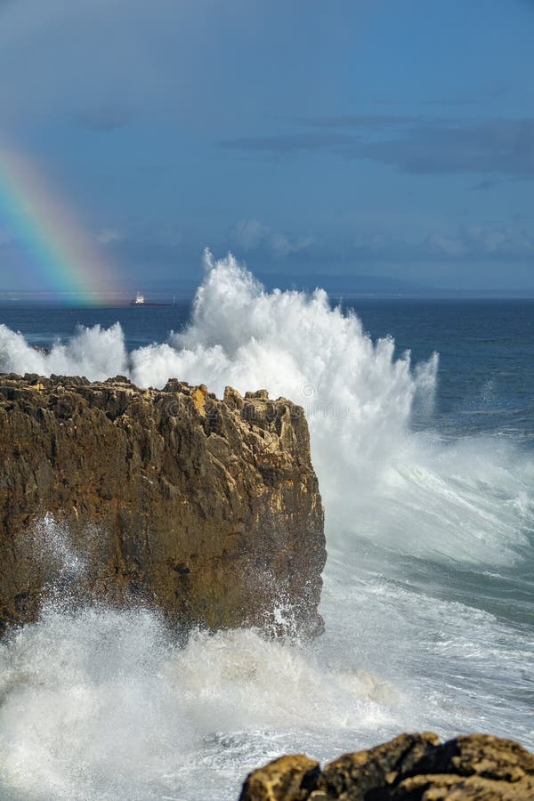 Wild Waves Breaking Over Cliff with Rainbow Stock Photo - Image of ...
