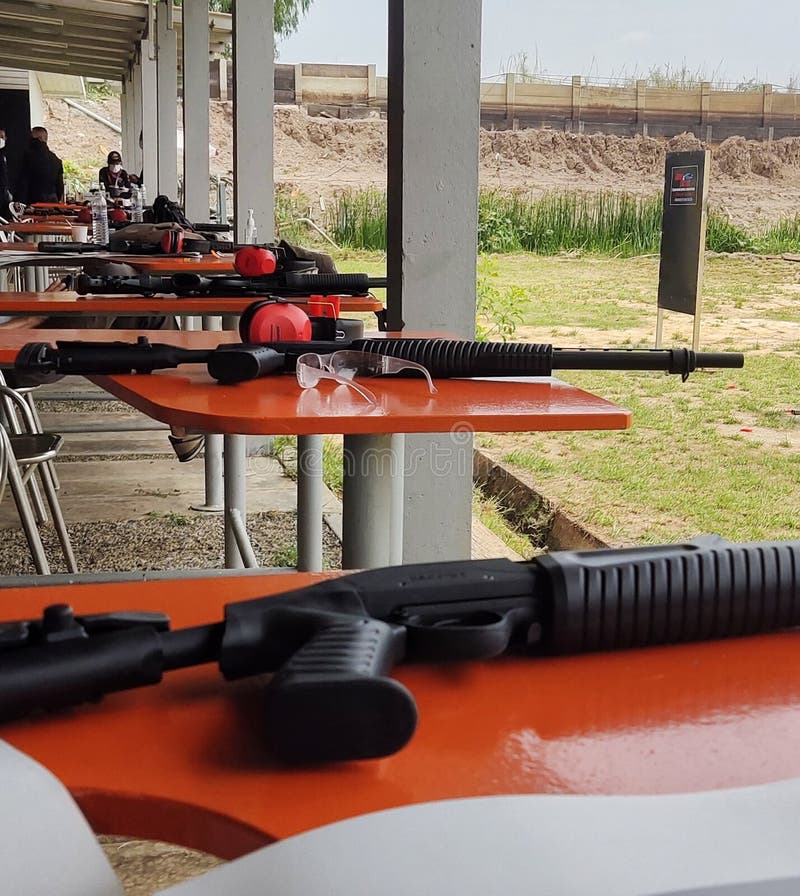 A Long Shotgun is Placed on a Table in a Shooting Range. ï¿¼ Stock ...
