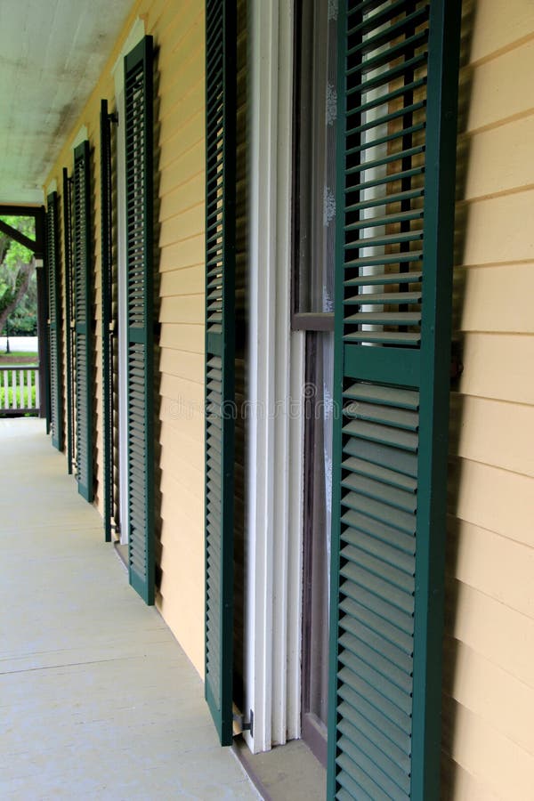 Long Shuttered Windows in Building Stock Photo - Image of covered ...