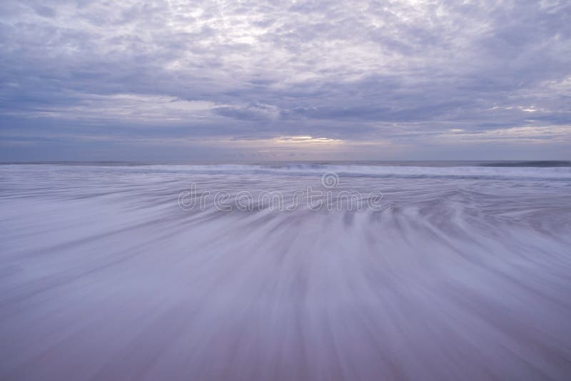 Long Speed Shutter of Tropical Sandy Beach with Sky and Clouds Over Sea ...
