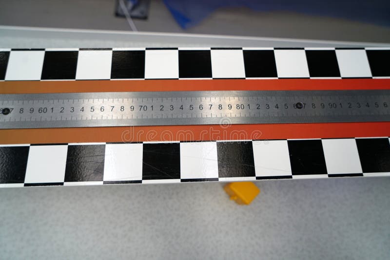 Long Steel Ruler Attached To a Surface Stock Photo - Image of isolated ...
