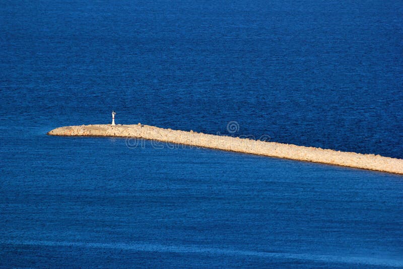 Long Stone Pier with Lighthouse at the End Stock Image - Image of ...
