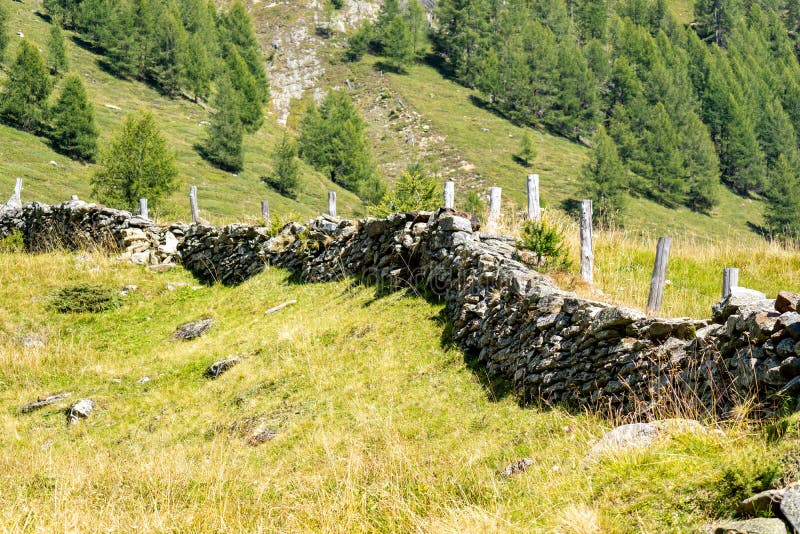 Long Stone Wall on a Sunny Green Valley Stock Image - Image of brick ...