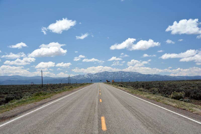 Long Straight and Empty Road Stock Photo - Image of mountain, blue ...