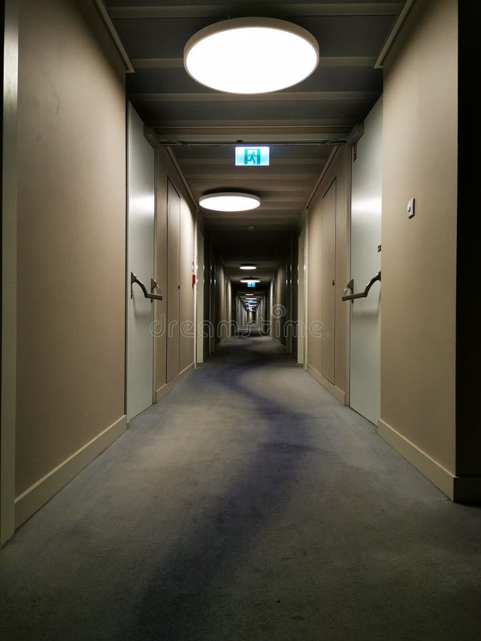 Long Straight Illuminated Hallway from a Hotel with Mirror Perspective ...