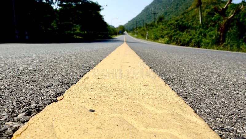 Long Stretch of Empty Highway with Solid Yellow Line on the Road in the ...