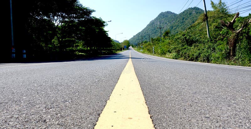 Long Stretch of Empty Highway with Solid Yellow Line on the Road in the ...