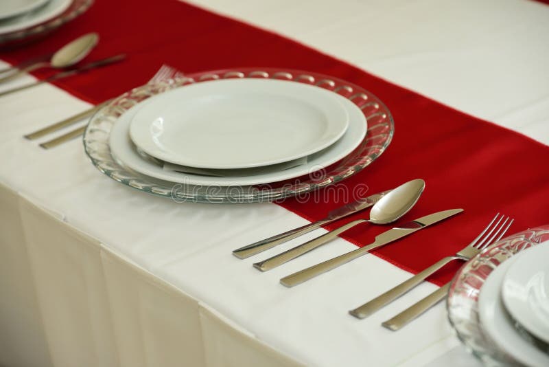 A Long Table with Plates, Silverware and Silverware Stock Image - Image ...